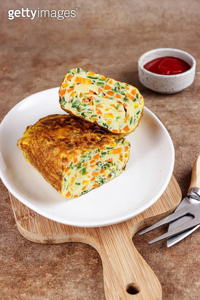 Telur dadar gulung. Tamagoyaki or Japanses egg roll. Gyeran Mari or ...
