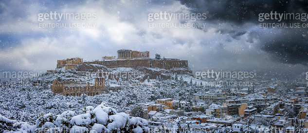 Panoramic view to the Acropolis of Athens during winter time with thick ...