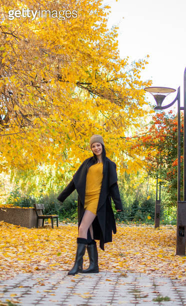 Young woman having fun in the city in autumn, walking, smiling, outdoor ...