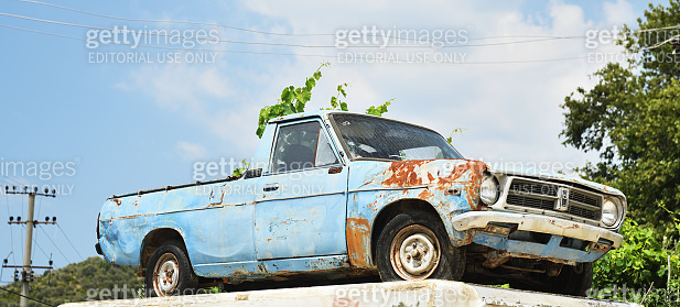 1984 Dodge Ram Old Blue. An old rusty blue pickup car stands in the ...