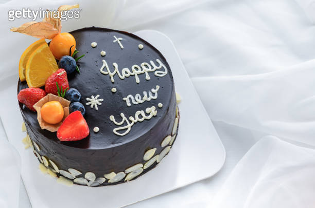 Chocolate cake topped with orange, strawberry, blueberry and Cape ...