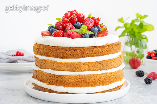 Homemade Naked Layered Vanilla Cake With Whipped Cream And Fresh
