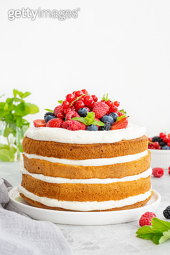 Homemade Naked Layered Vanilla Cake With Whipped Cream And Fresh