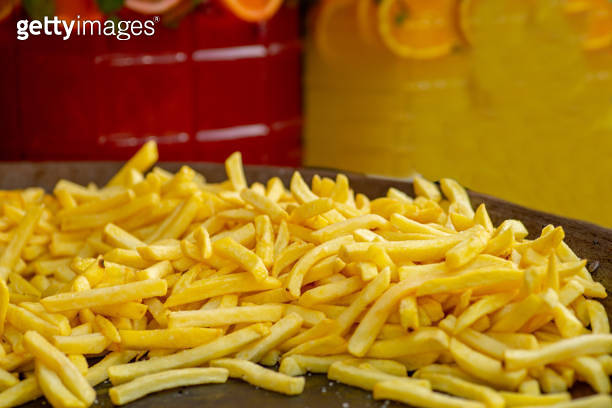 Pile of French fries in the food court tray. Street food. Fast food ...