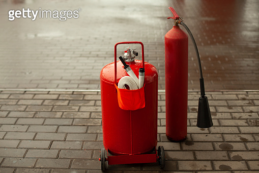 Fire extinguisher at the gas station. Special means of safety against ...