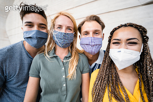 Young multiracial people wearing safety masks during coronavirus ...
