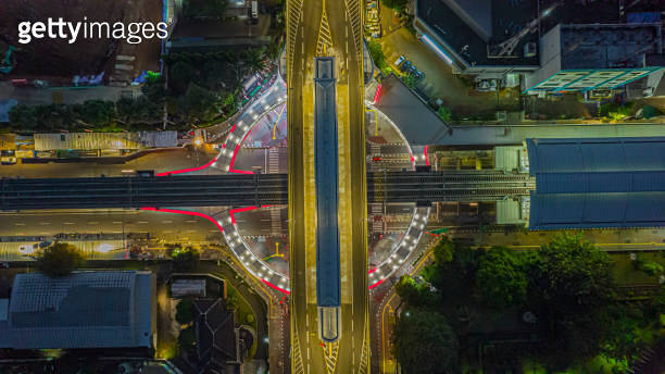 Aerial view of articulated city buses arriving and leaving at bus ...