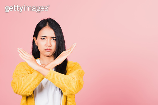 woman unhappy or confident standing wear holding two cross arms say no ...
