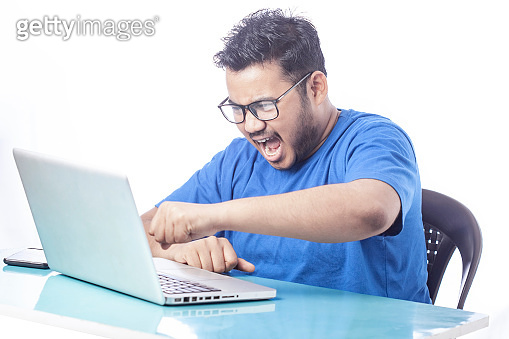 aggressive angry man yelling and breaking laptop screen (1355129322 ...