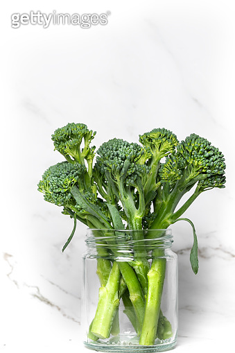 broccoli bimi on a white background in a glass beaker. selective focus ...
