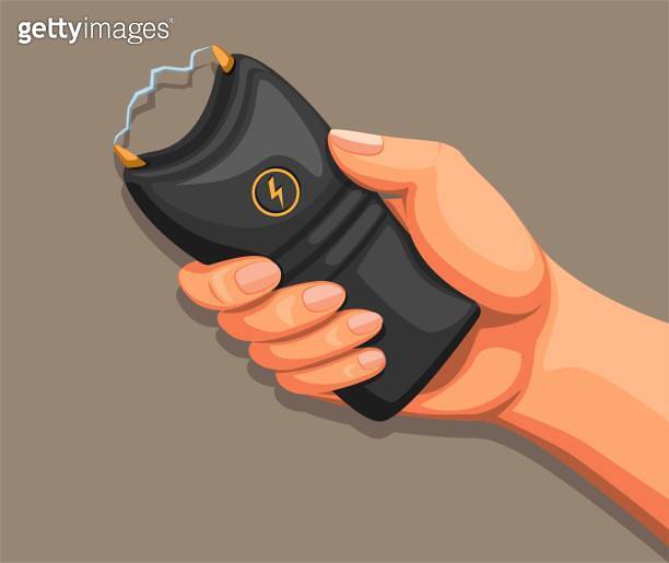 Hand holding taser or stun gun. weapon equipment for self defense ...