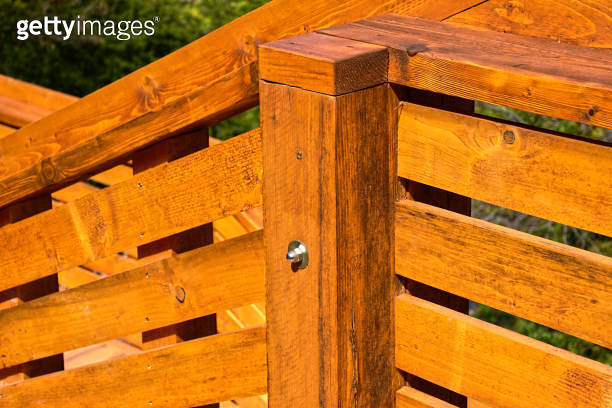 Stained yellow pine guard rail and balustrade. wooden post and ...