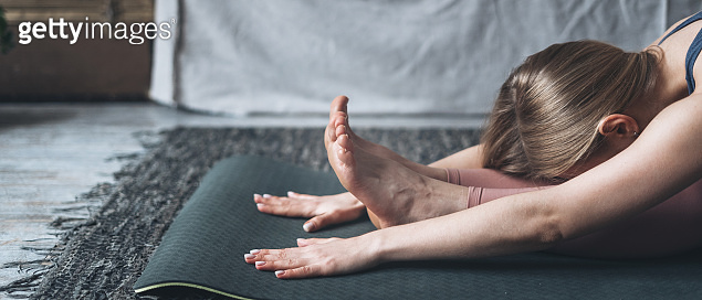 Woman stretching body in seated forward bend position 이미지 (1328837031 ...