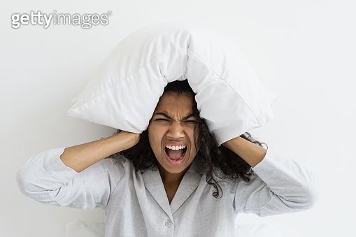 Angry african american woman scream, covered head with pillow 이미지 ...