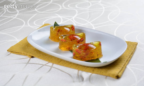 chinese dessert cold jelly with gui Hua flower yellow pudding in yuan ...
