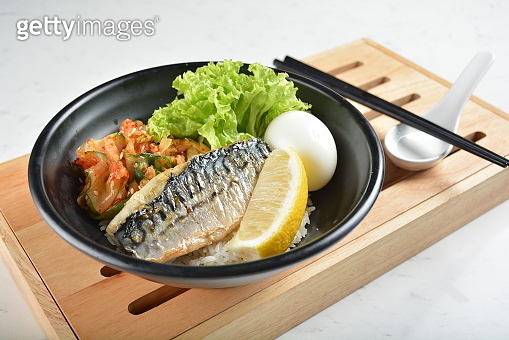 bbq grill korean saba fish seafood with lemon, boiled egg, kimchi and ...