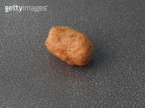 deep fried mini hot dog sausage luncheon meat with spicy sauce on dark ...