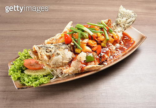 deep fried crispy whole grouper fish with vegetables in sweet and sour ...