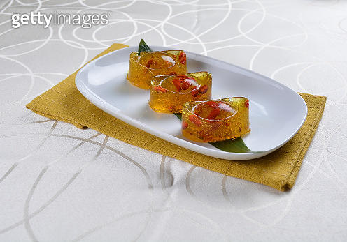 chinese dessert cold jelly with gui Hua flower yellow pudding in yuan ...