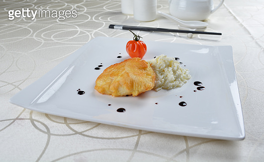 deep fried cod fish seafood with egg white and dark soy sauce in white ...