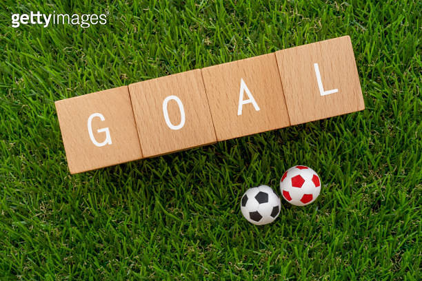 GOAL; Wooden blocks with "GOAL" text of concept and soccer ball toys ...