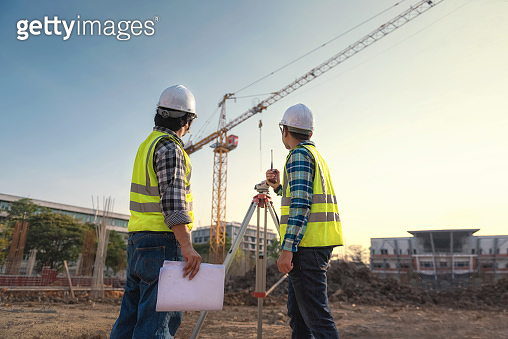 Civil engineer inspects work using radio communication with the ...
