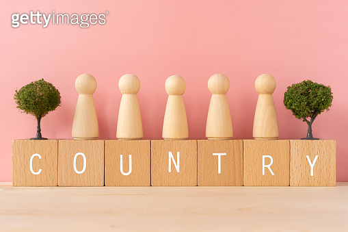 COUNTRY; Wooden blocks with "COUNTRY" text of concept, human toys, and ...