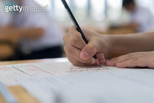 Asian Students hands holding pencil doing multiple-choice quizzes or ...