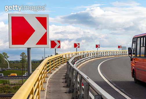 modern road interchange and road signs indicating the direction of the ...