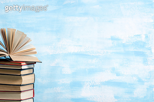 Books on wooden desk table and abstract background. Education ...