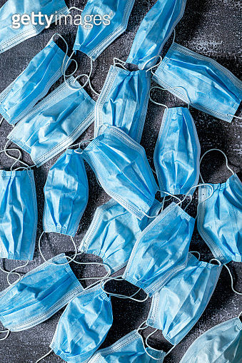 Used face mask,Used blue surgical protective masks. Pollution by ...