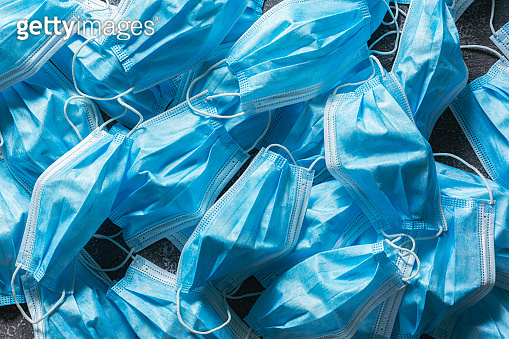 Used face mask,Used blue surgical protective masks. Pollution by ...