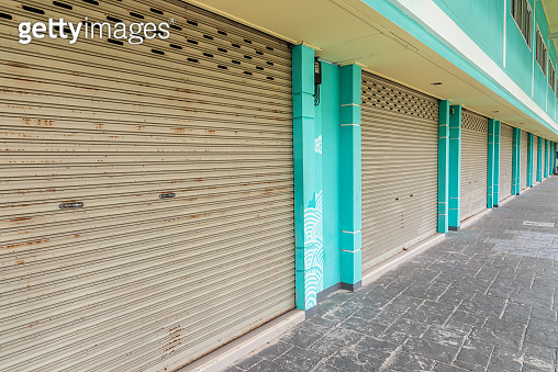 Closed steel shutter door of warehouse, storage or storefront for metal ...
