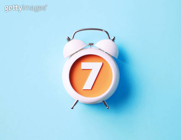 Number Seven Sitting Over White Alarm Clock On Blue Background 이미지 ...