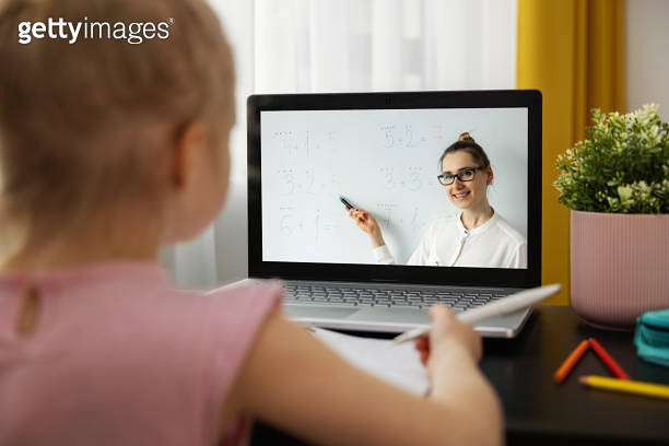distance learning - primary school teacher explaining basic mathematics ...