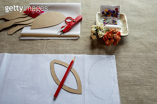 Fabric and patterns are laid out on the desktop. Needlework, hobbies ...