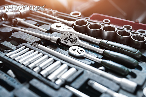 Above view of used greasy old dirty car repair mechanic hand tool set ...