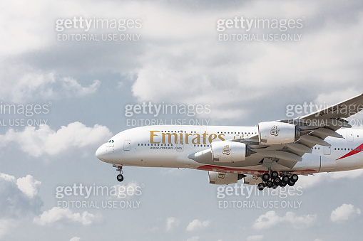 The nose of a heavy Emirates Airlines Airbus A380-800 four engine jet ...