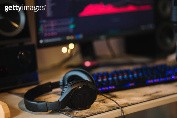 Workplace of musician at home. Table with pc, microphone and headphones ...