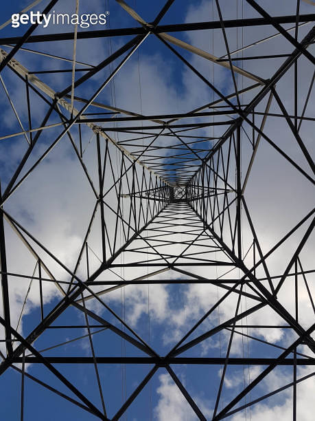 electricity pylons down to the top view cords blue sky clouds ...