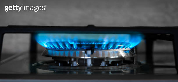 Methane Gas. Gas cooker with burning flames of propane gas. Kitchen ...