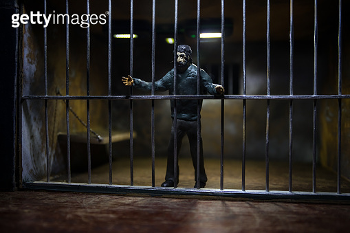 Jail or prison cell. Man in prison man behind bars concept. Old dirty ...