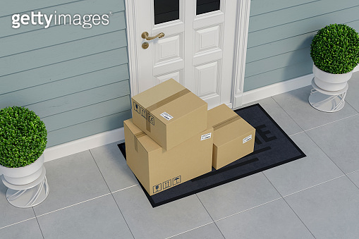 Stack of boxes on the doormat near entrance door. Parcel delivery ...