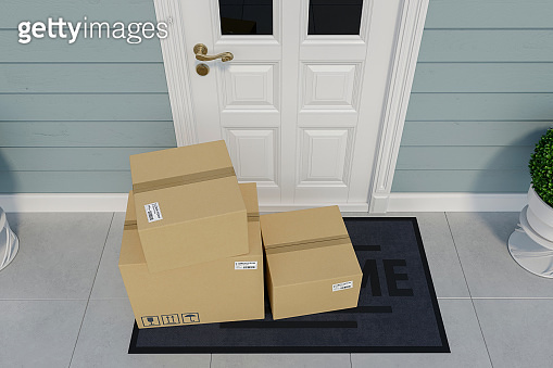Stack of boxes on the doormat near entrance door. Parcel delivery ...