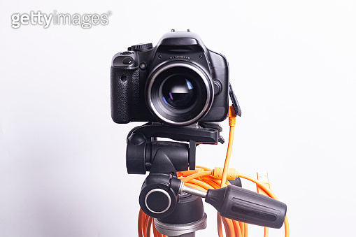 Digital photo camera on black tripod with orange cable 이미지 (1297190263 ...
