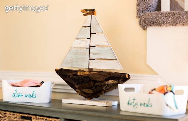 Clean and dirty storage bins await home occupants as they walk in the ...