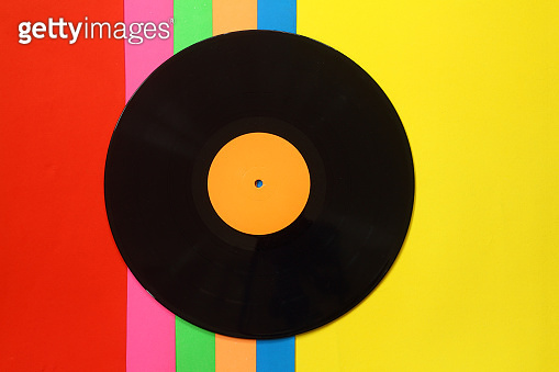12-inch LP vinyl record disk with blank red label. Close-up shot, top ...