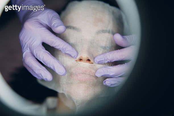 Paraffin Face Mask gauze bandage Therapy Young Woman Receiving Facial ...