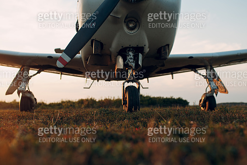 Small private single engine propeller airplane at sunset regional ...