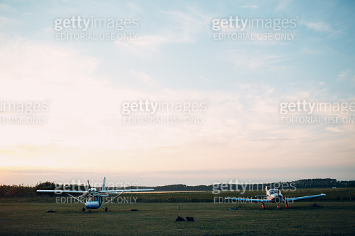 Small private single engine propeller airplane at sunset regional ...